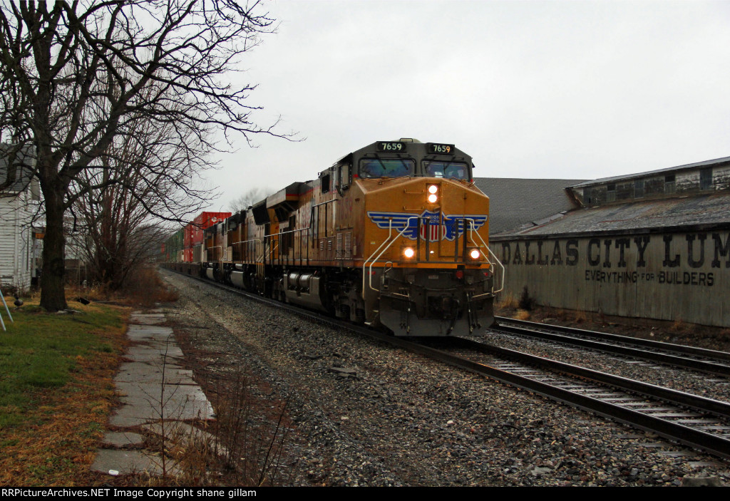 UP 7659 Heads Eb with a stack train.
